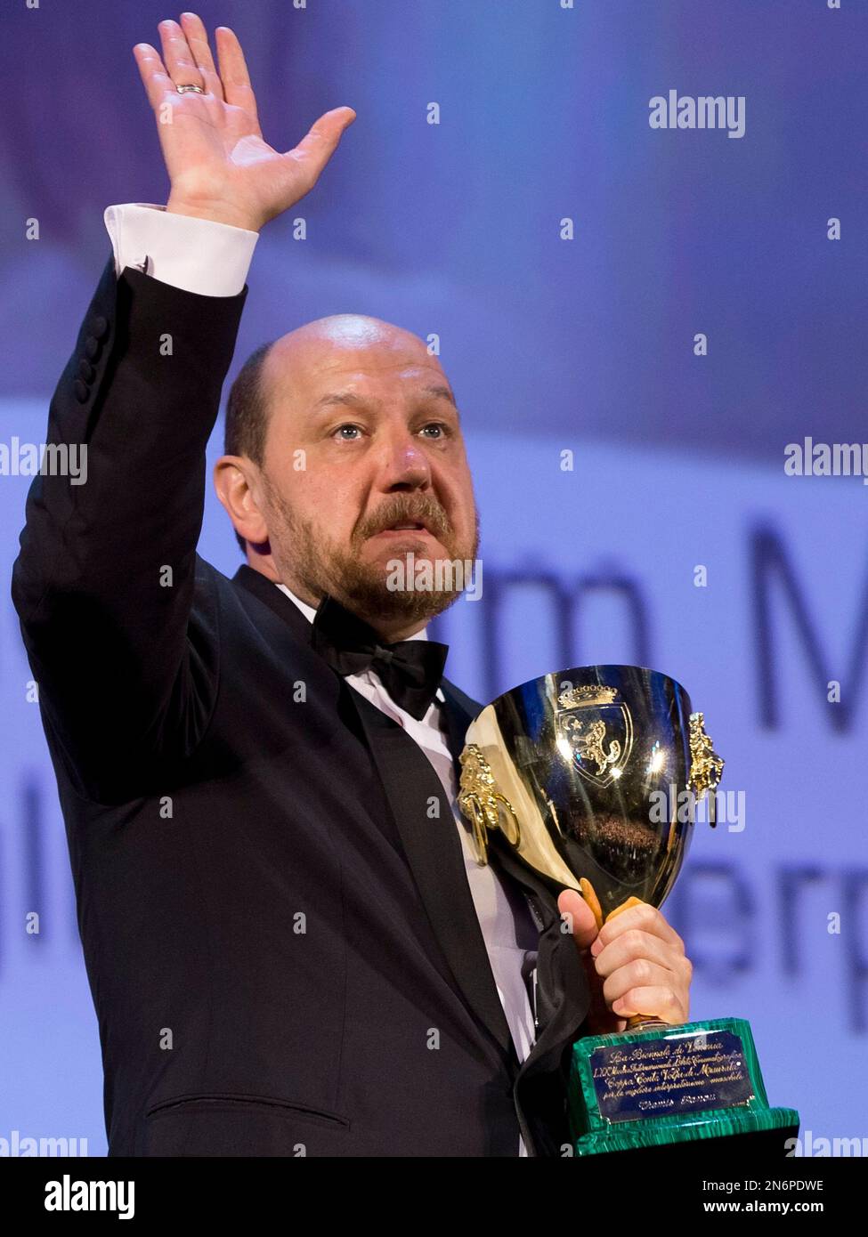 Actor Themis Panou holds his Volpi Cup for Best Actor for his role in ...