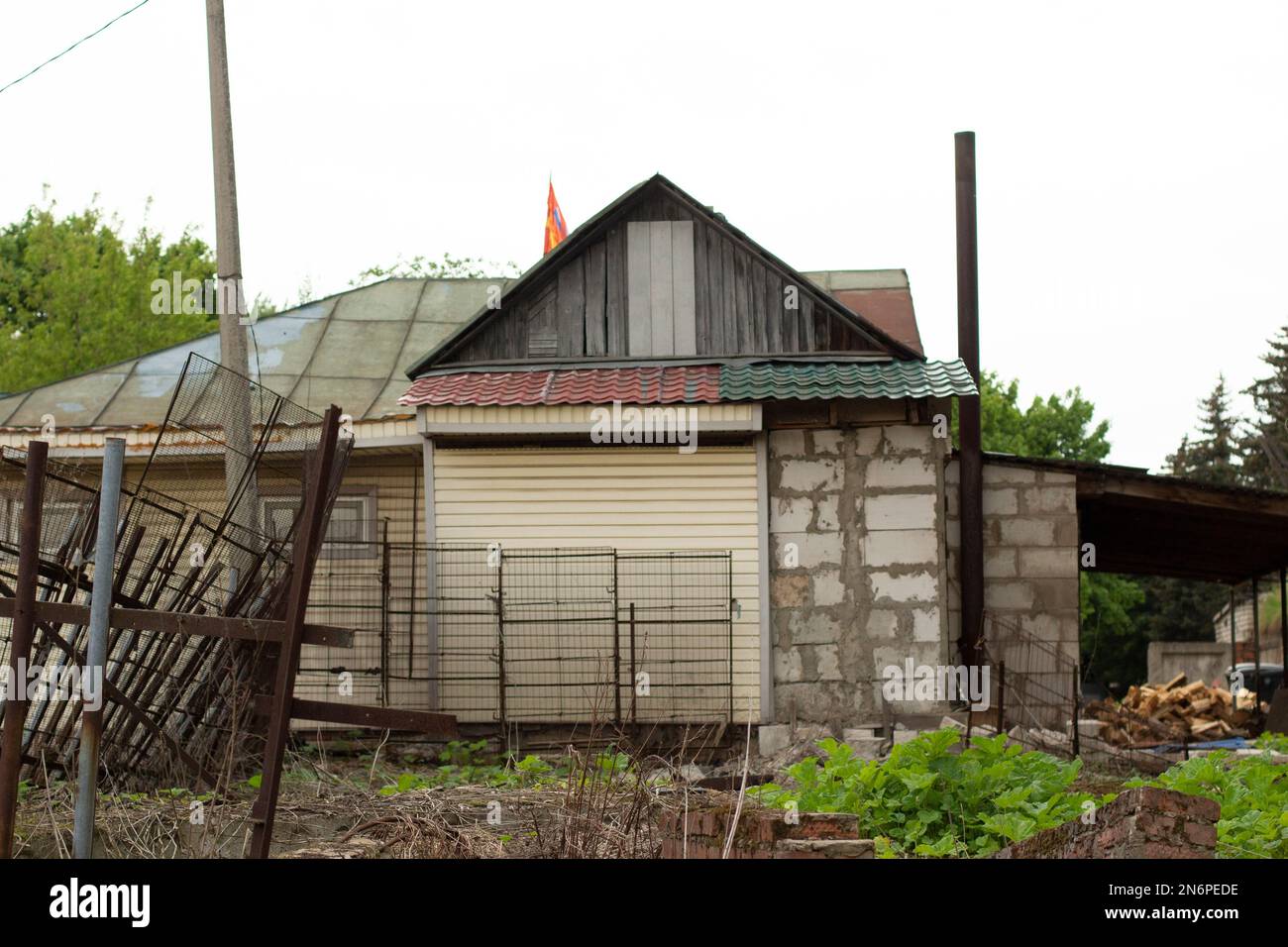 House in village. Summer in countryside. Simple house to live outside ...