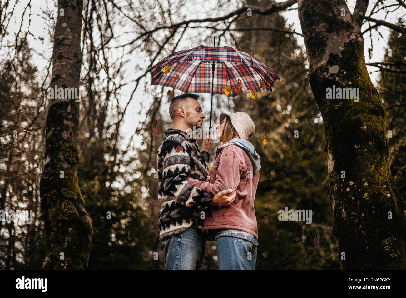 Couple standing face to face, both protected by love and by the ...