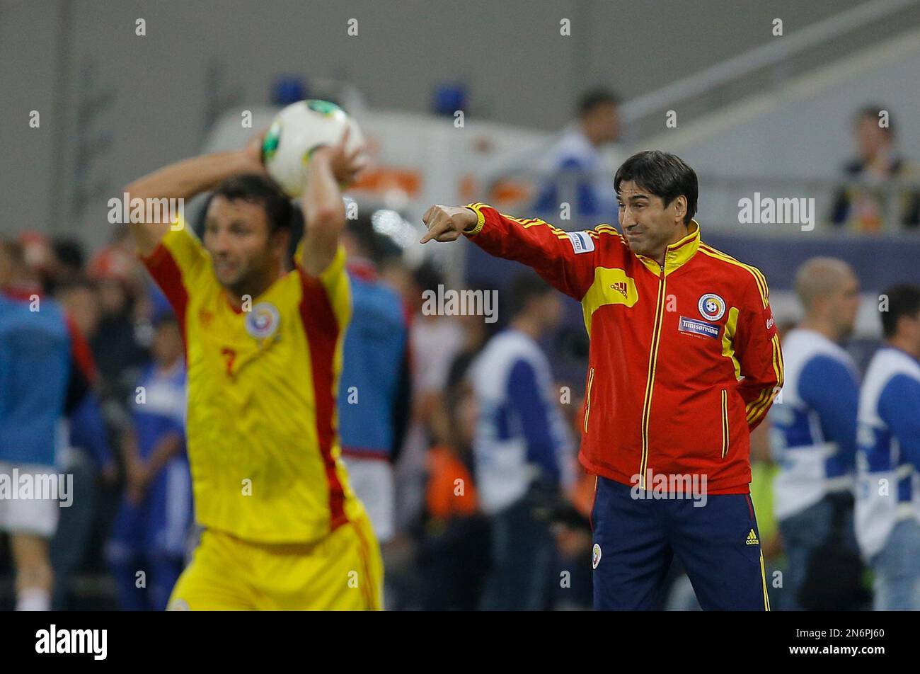 Romanian coach Victor Piturca, right, gestures during the 2014 FIFA ...