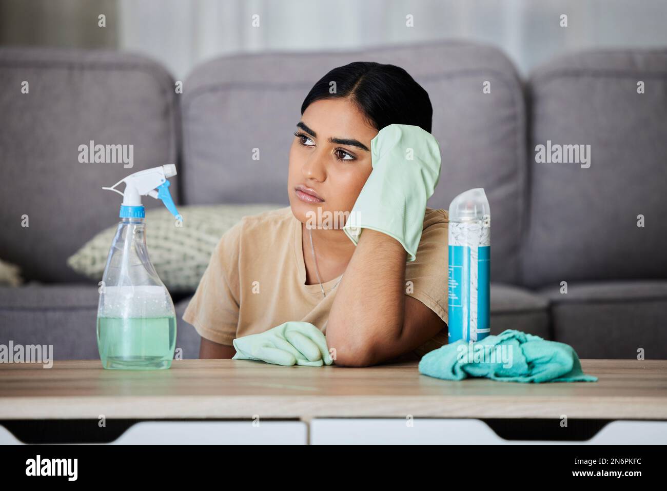 House, cleaning and bored woman thinking, tired and annoyed with ...