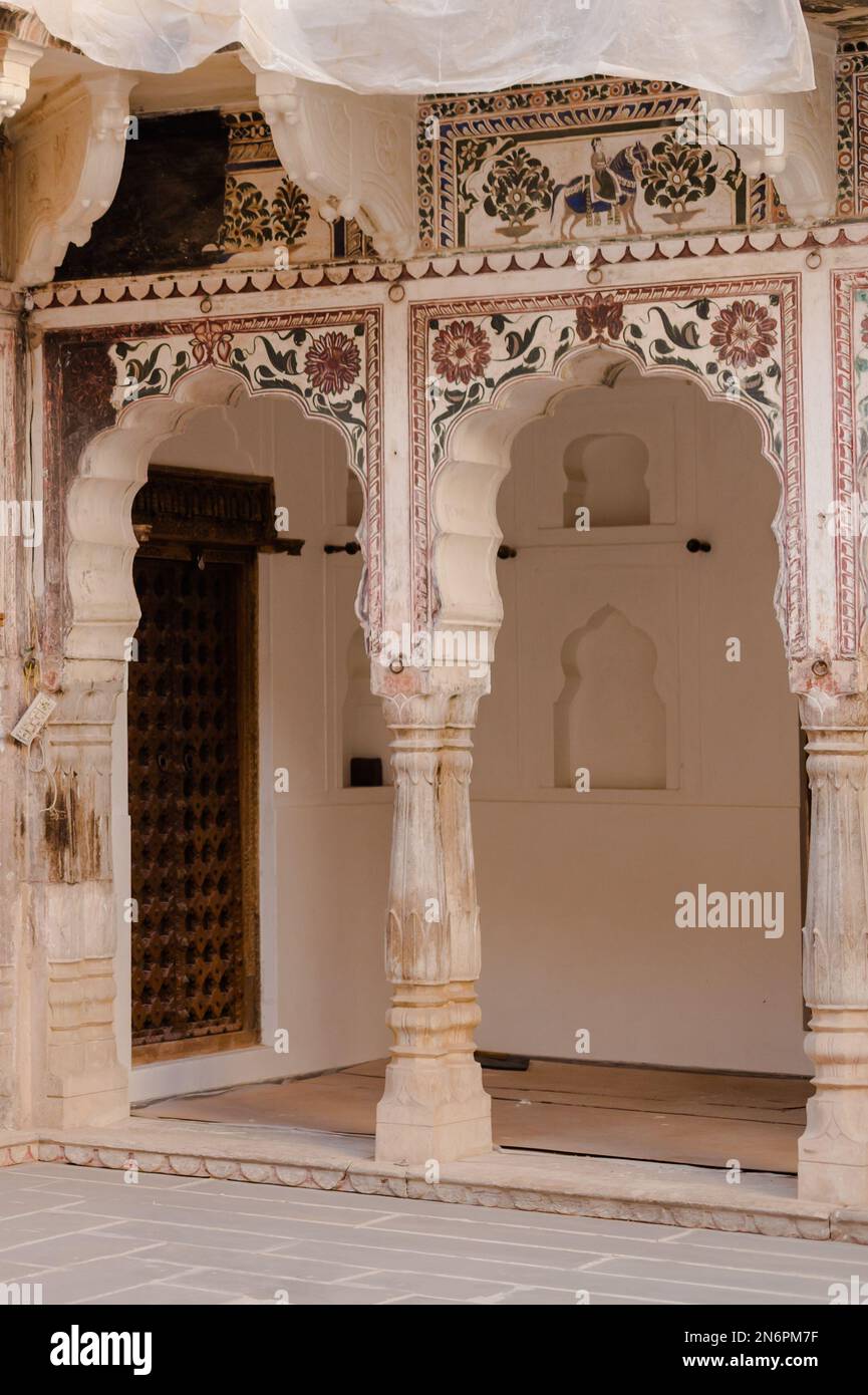 A vertical of a Haveli house, the wooden doors with carvings in Mandawa ...