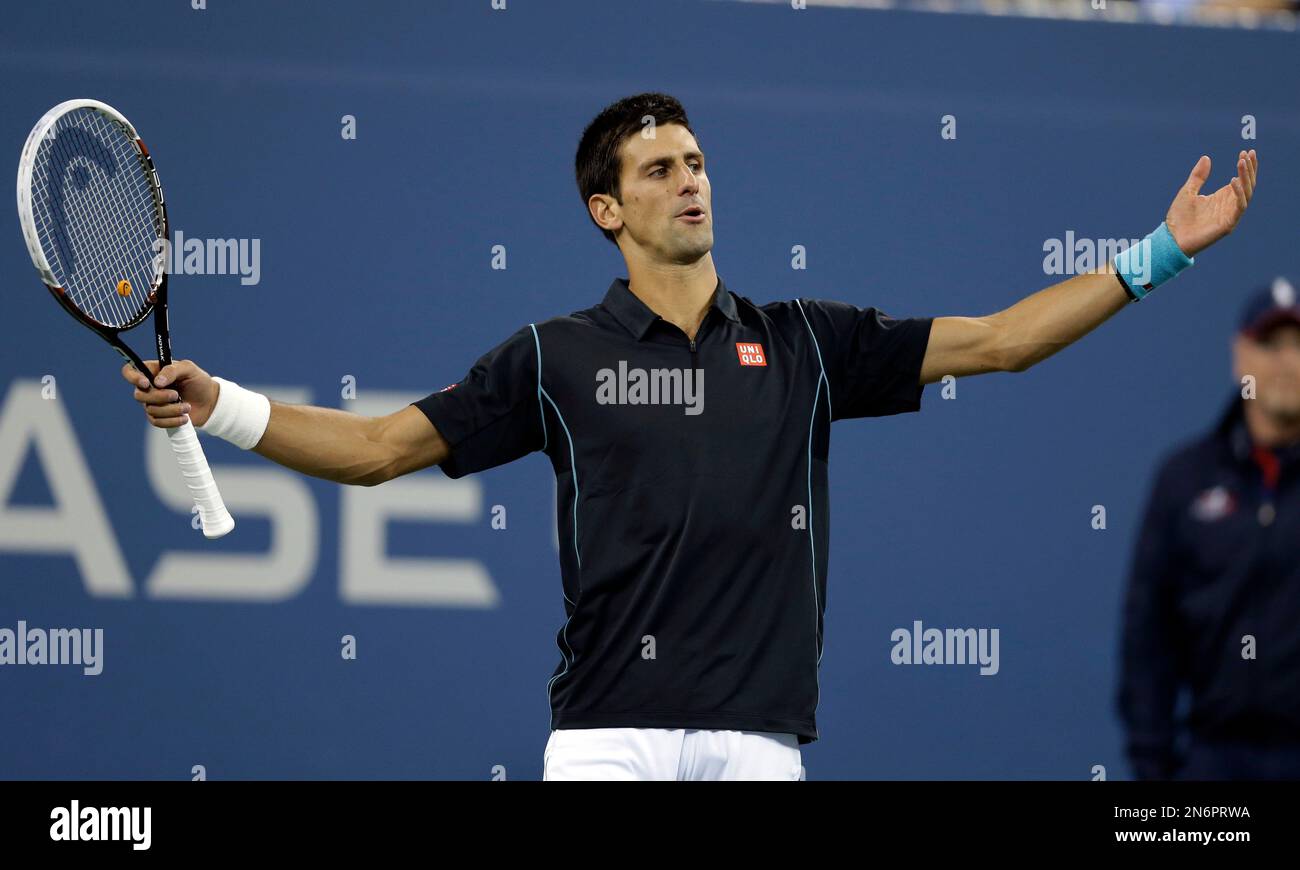 Novak Djokovic, Serbia, reacts following a line call during a ...