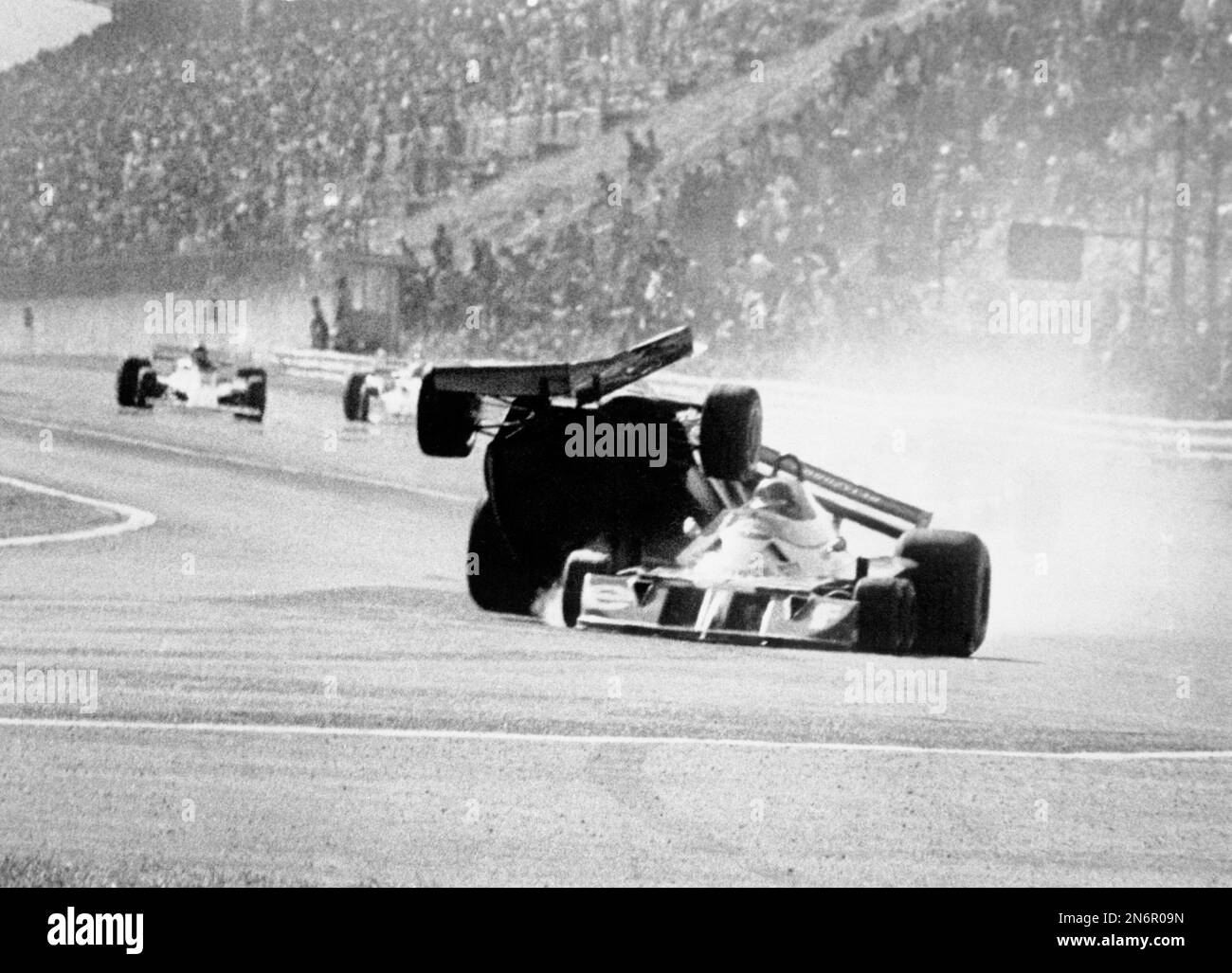 Ferrari 312 T2 driven by Gilles Villeneuve of Canada hits the Tyrell ...