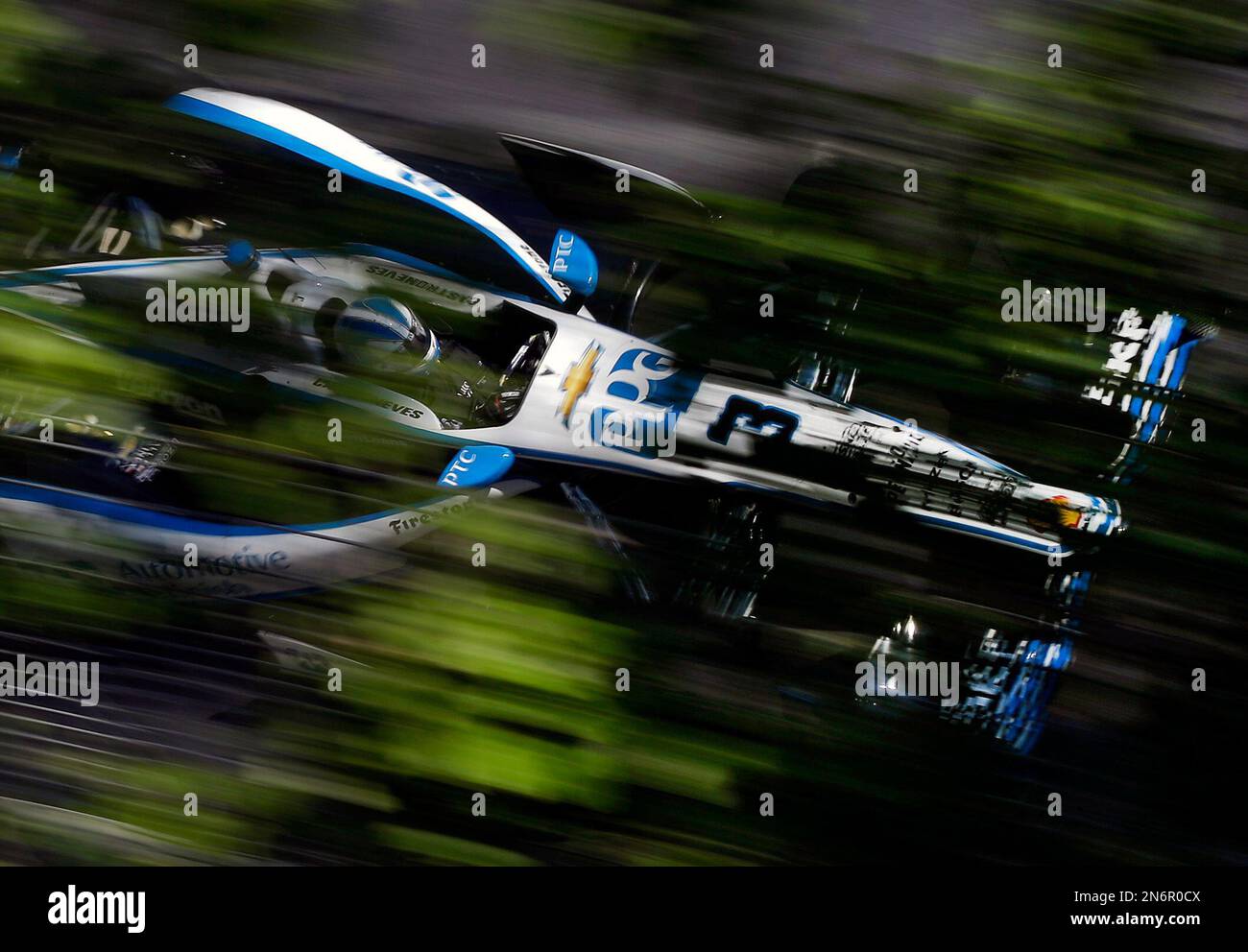 AP10ThingsToSee - Helio Castroneves, of Brazil, drives under a canopy ...