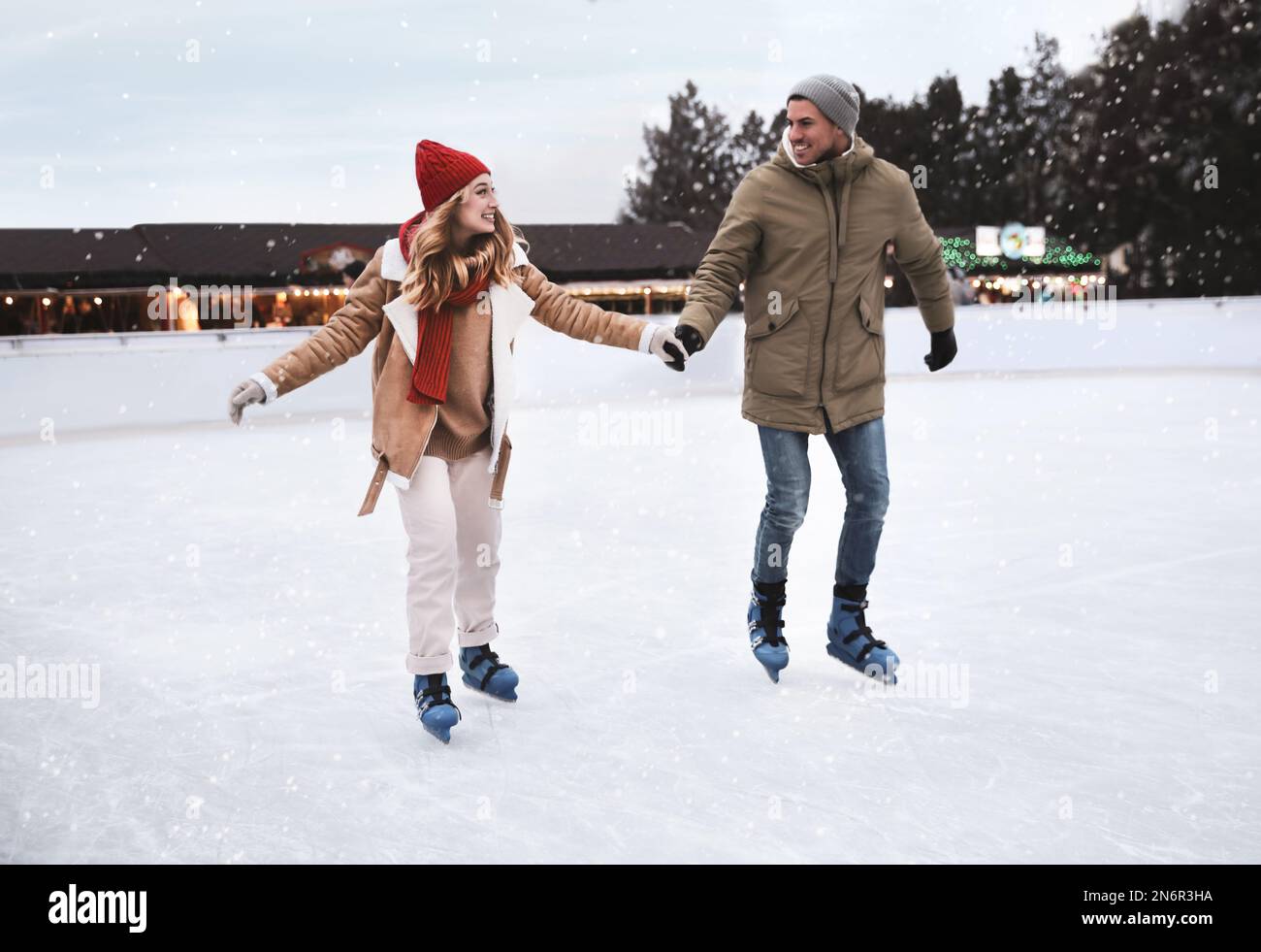 Happy couple skating outdoor hi-res stock photography and images - Alamy