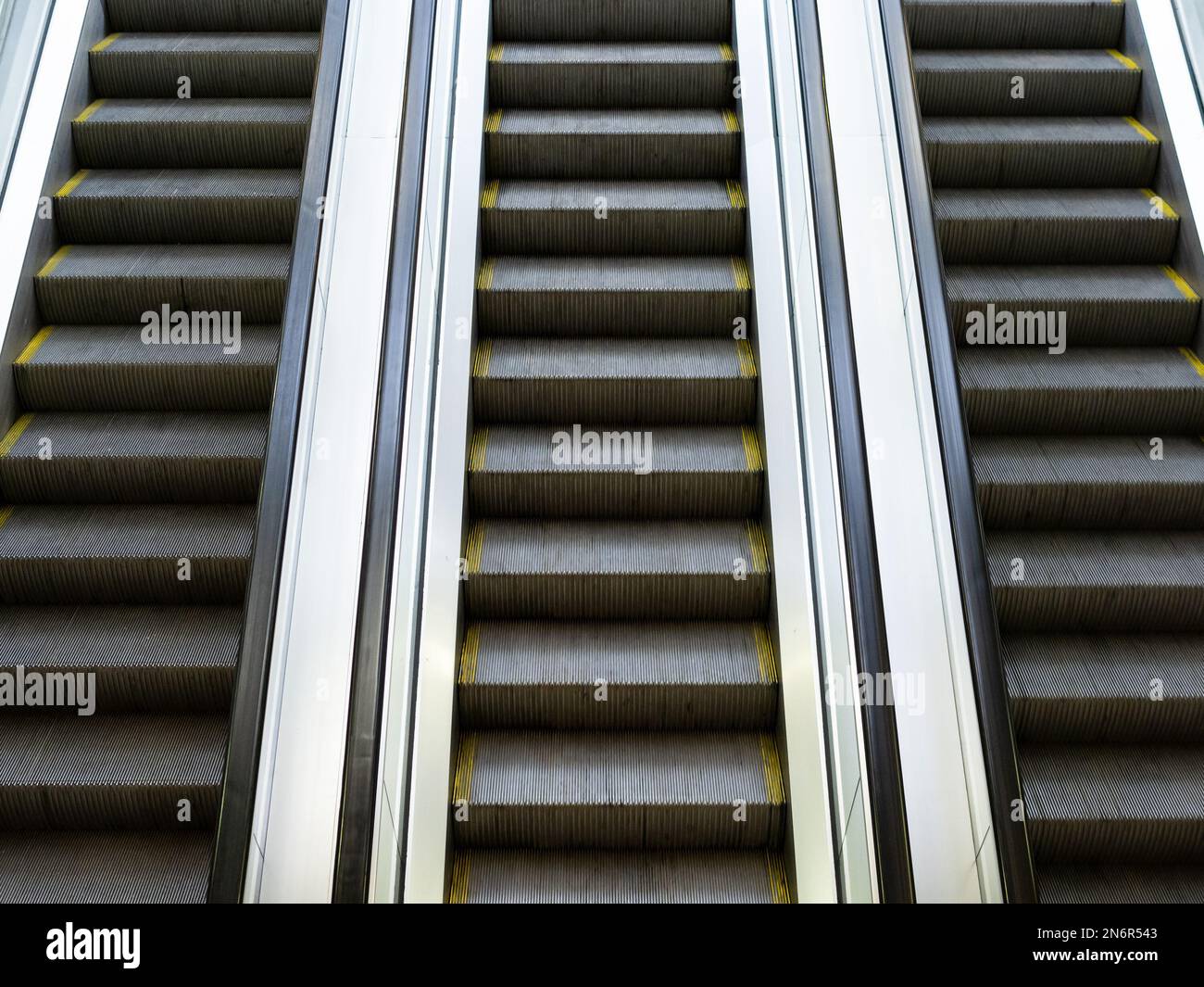 three way of indoor escalator with moving middle lane Stock Photo - Alamy