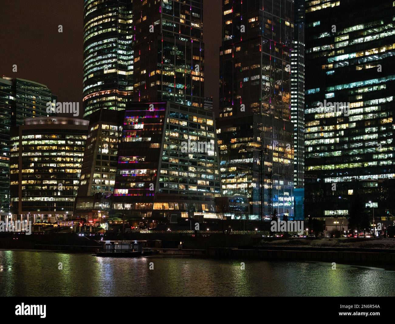 view of glass towers in Moscow city business district in night on ...