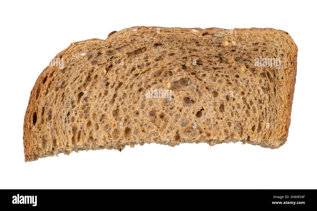 dried slice of brown wholegrain bread cutout on white background Stock ...