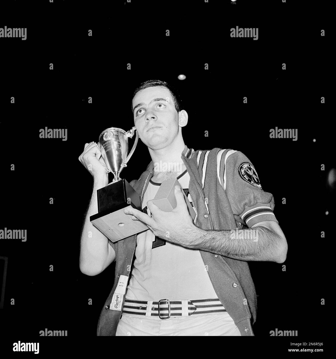 Ohio State's Jerry Lucas displays the most valuable player trophy ...
