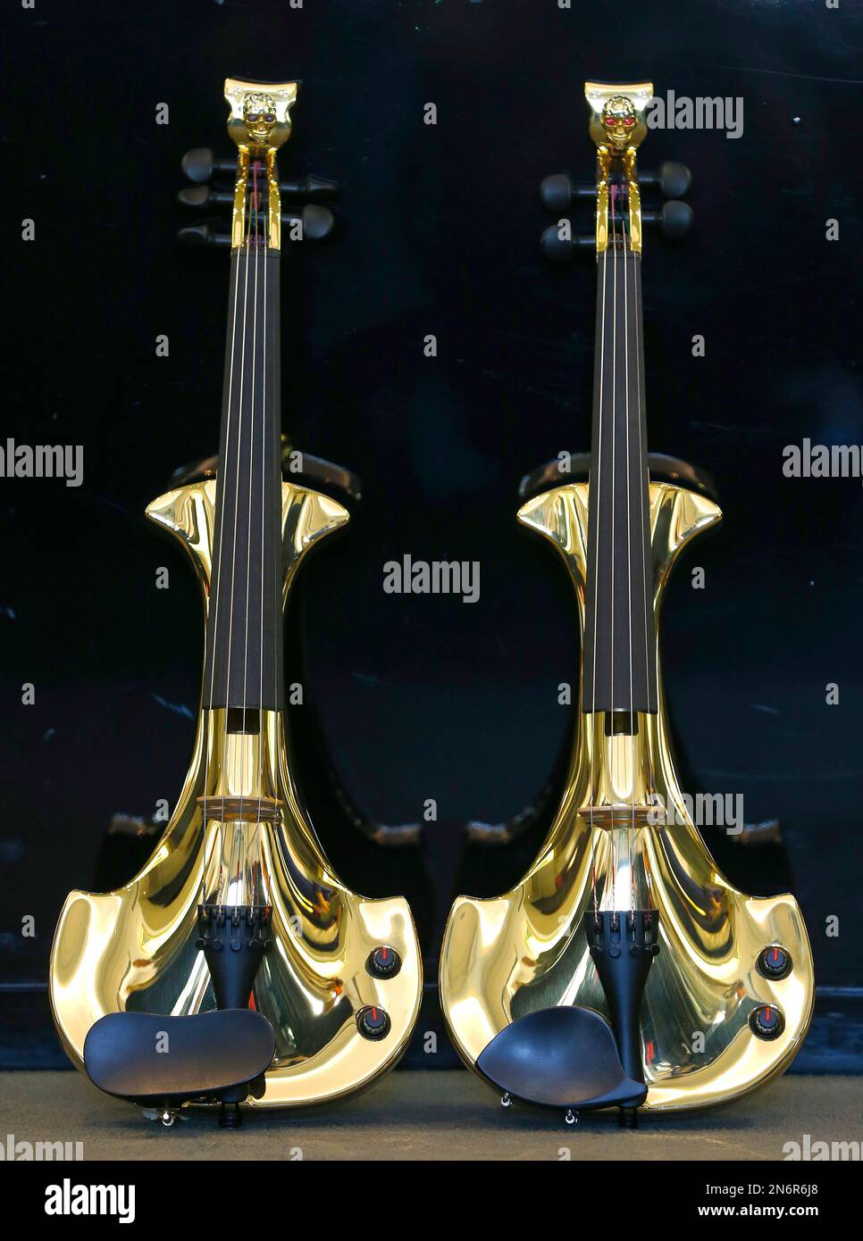 Two 24-carat gold plated violins adorned with ruby, sapphire and ...