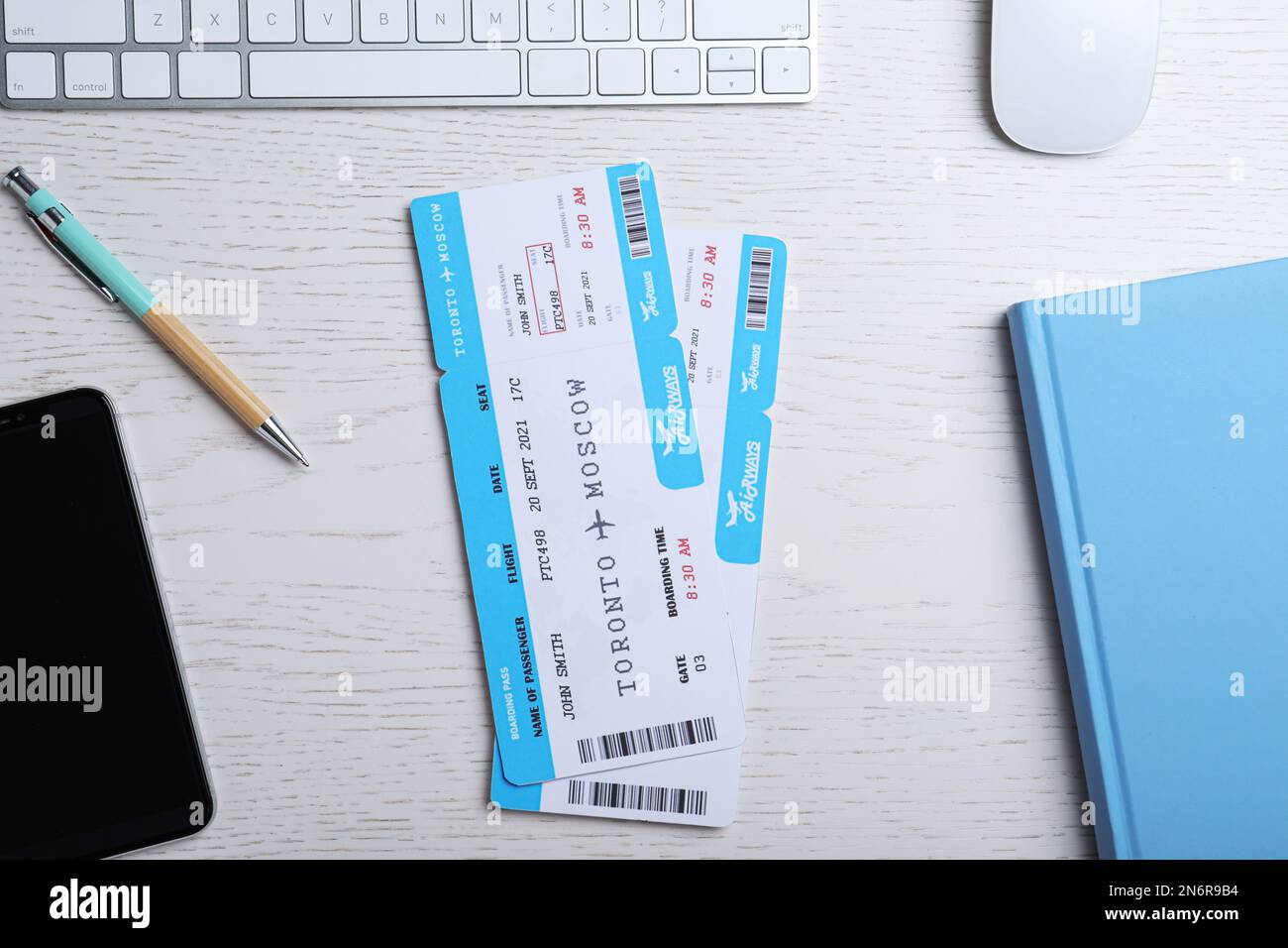 Flat lay composition with avia tickets on white table. Travel agency concept Stock Photo - Alamy