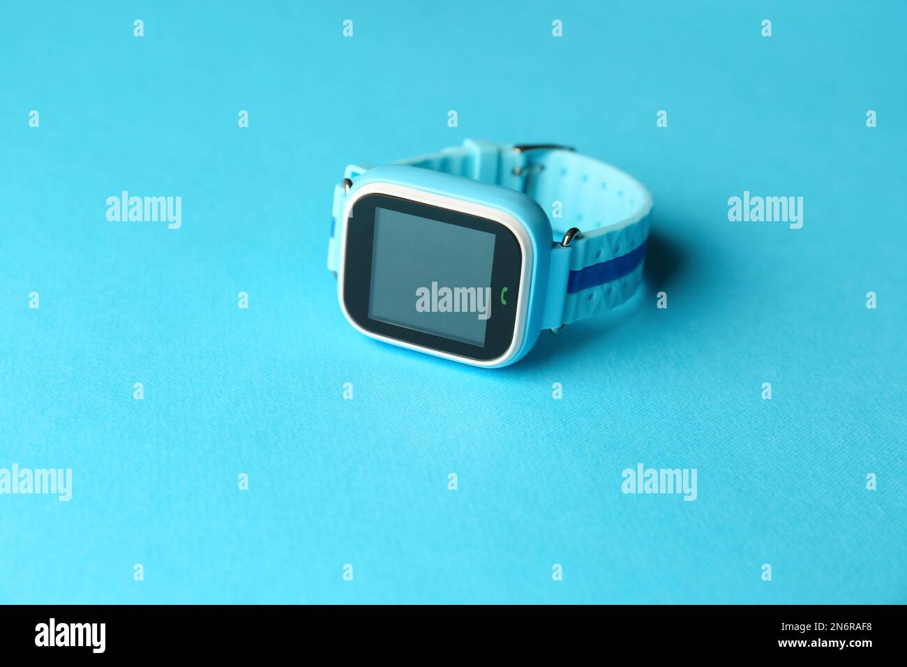 Modern trendy smart watch for kids on light blue background Stock Photo ...