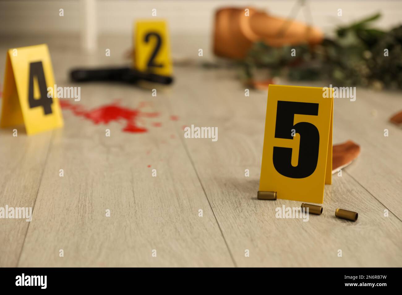 Crime scene markers and casings on floor indoors Stock Photo - Alamy