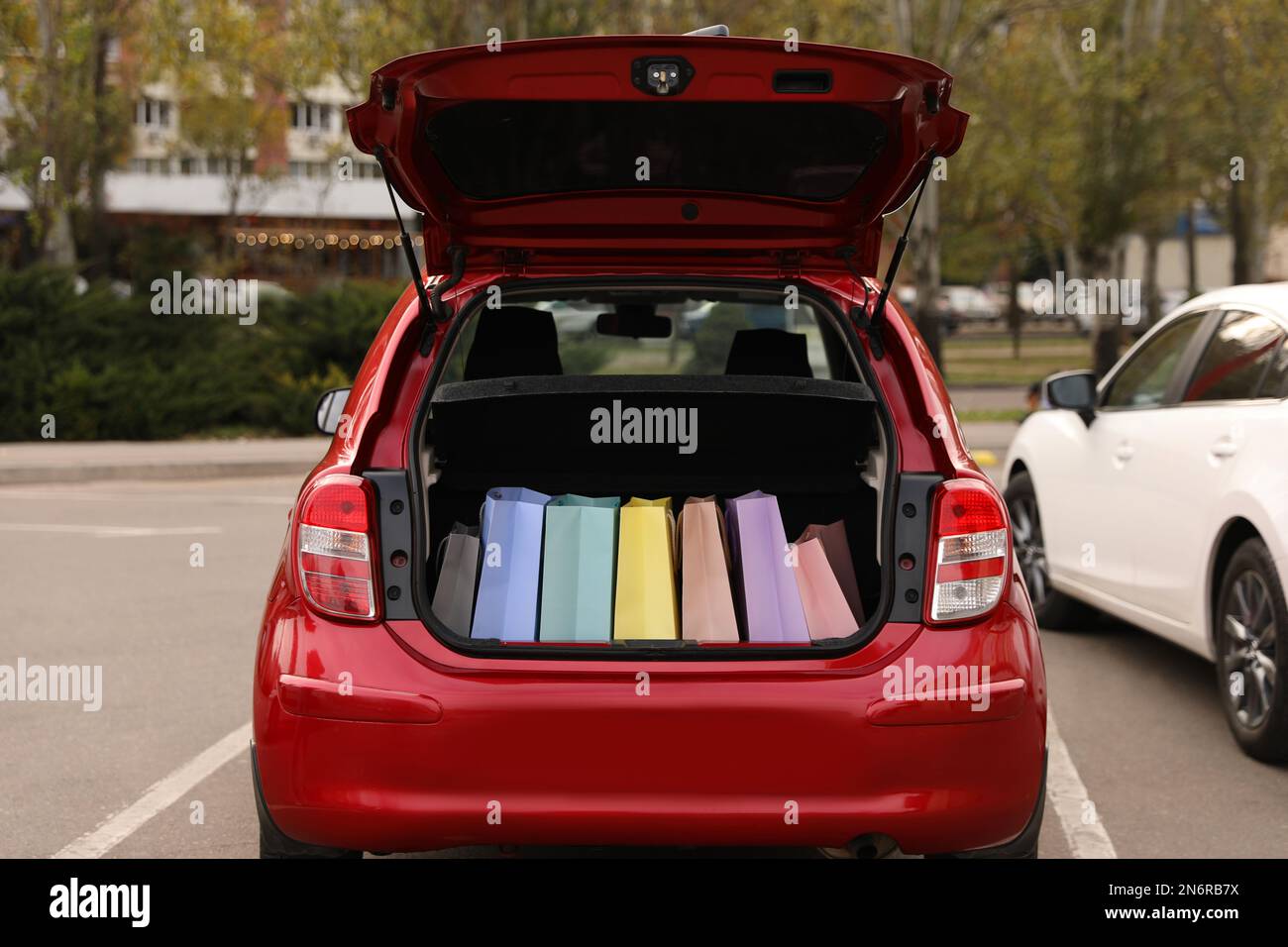 Car trunk full of shopping bags outdoors Stock Photo - Alamy