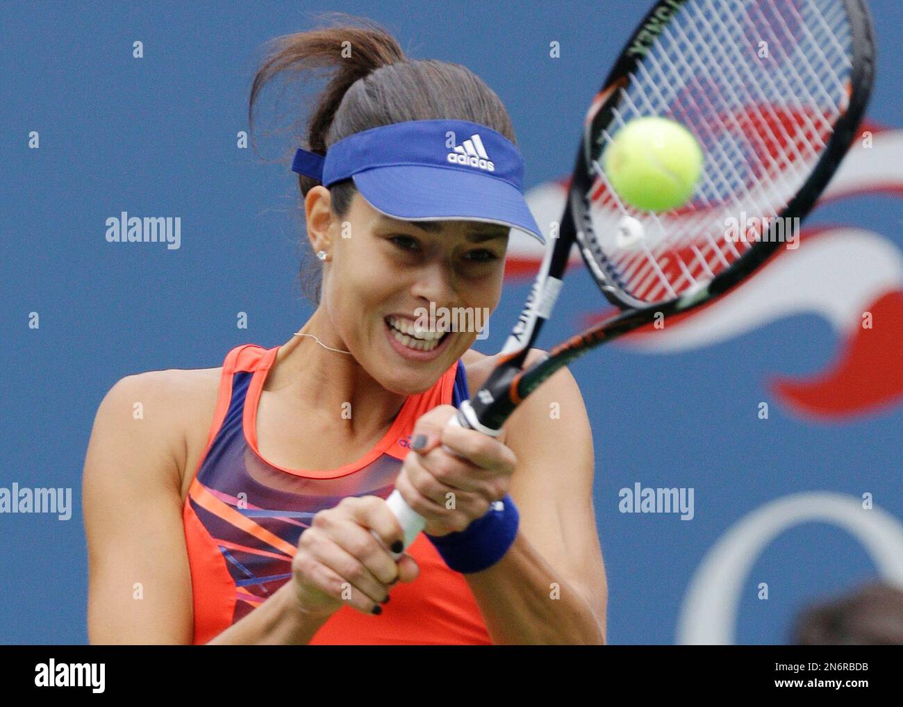 Ana Ivanovic, of Serbia, returns a shot to Victoria Azarenka, of ...