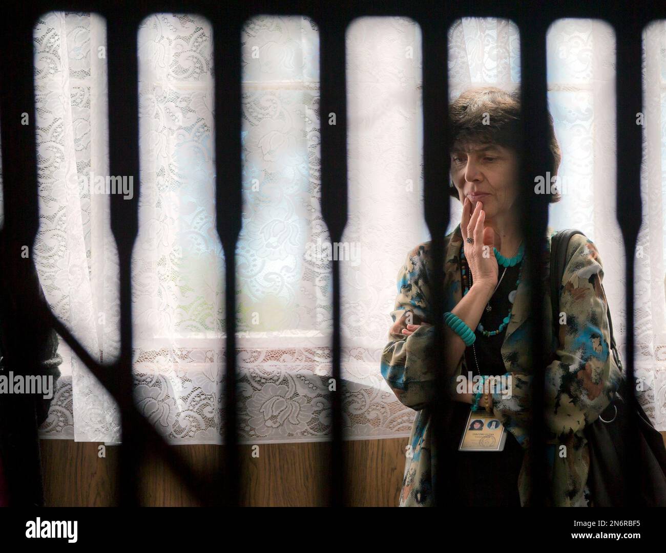 A woman pauses outside the room where Nicolae Ceausescu and his wife ...