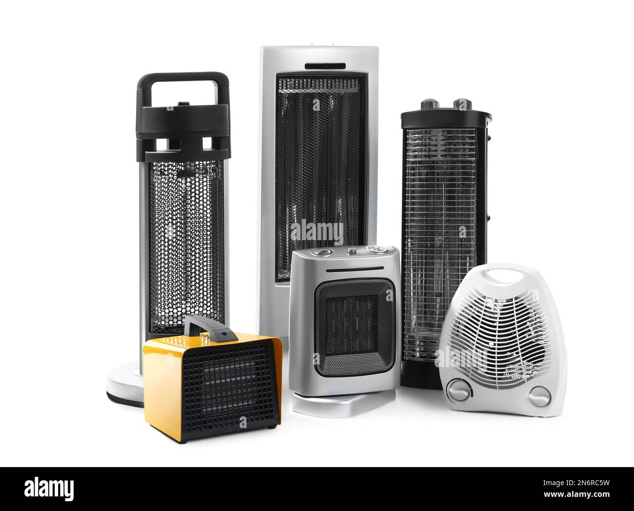 Many different electric heaters on white background Stock Photo - Alamy