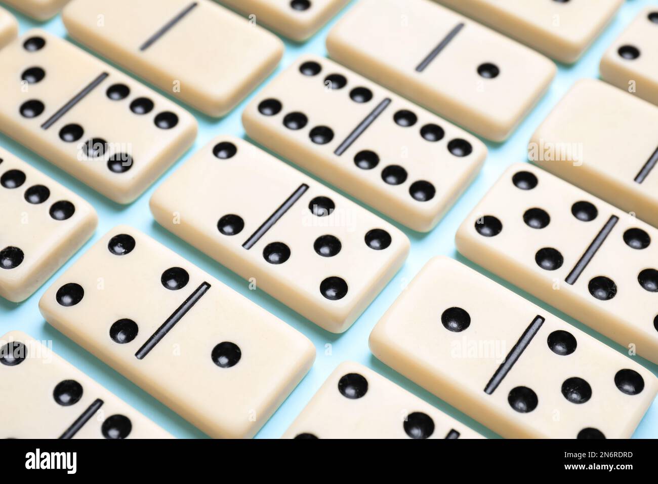 Set of classic domino tiles on light blue background, closeup Stock ...