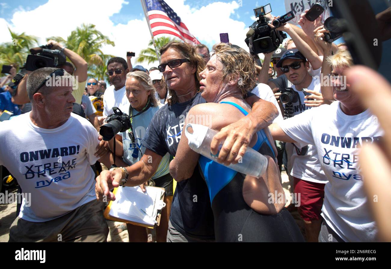 Endurance swimmer Diana Nyad, right, and her trainer, Bonnie Stoll hug ...