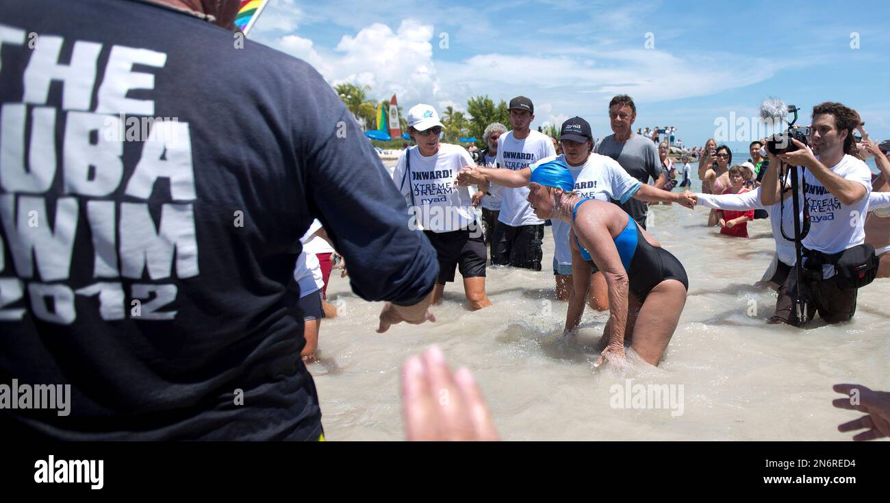 U.S. endurance swimmer Diana Nyad walks on to the Key West, Fl., shore ...