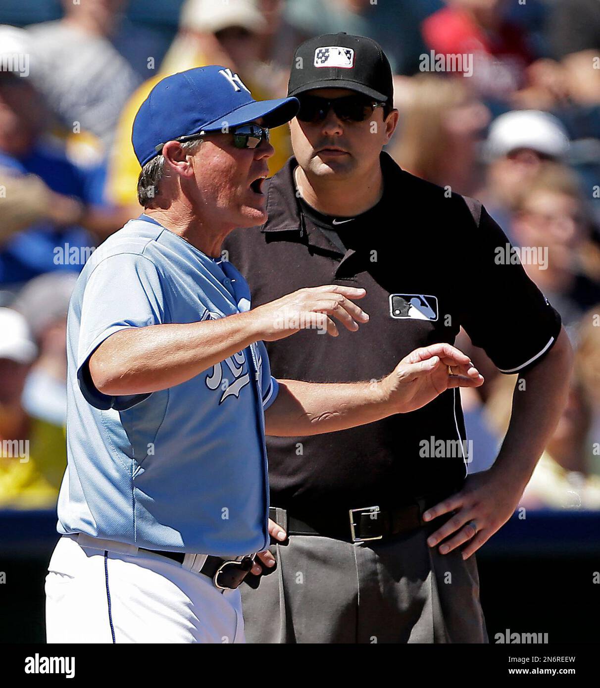 Kansas City Royals manager Ned Yost, left, argues a call with third ...