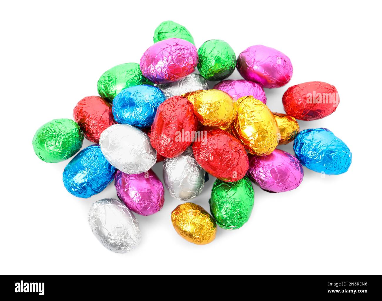 Many chocolate eggs wrapped in bright foil on white background, top ...