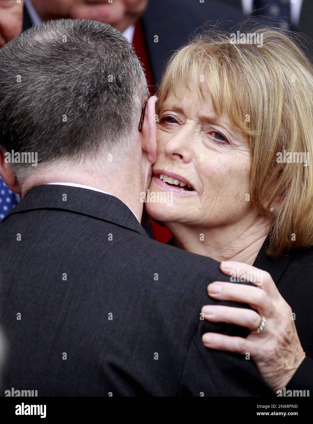 Marie Heaney is comforted during the funeral of her husband, Irish poet ...