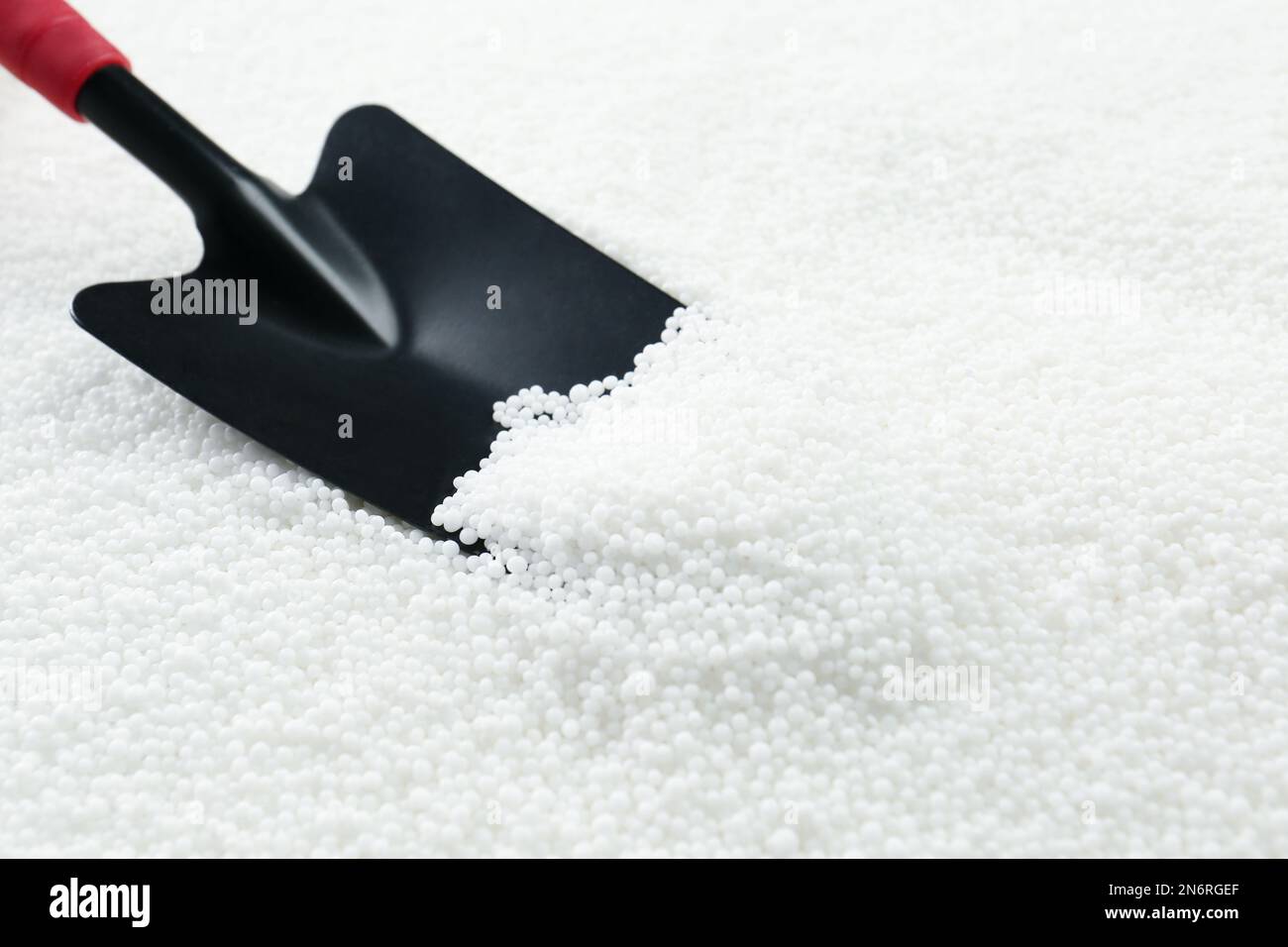 Shovel and granular mineral fertilizer, closeup view Stock Photo - Alamy