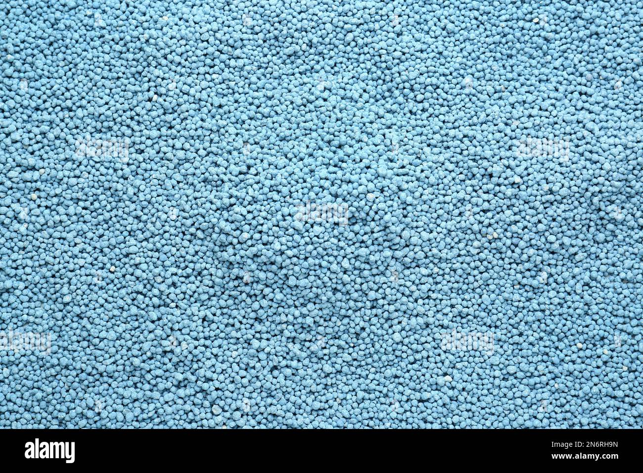 Blue granular mineral fertilizer as background, top view Stock Photo ...