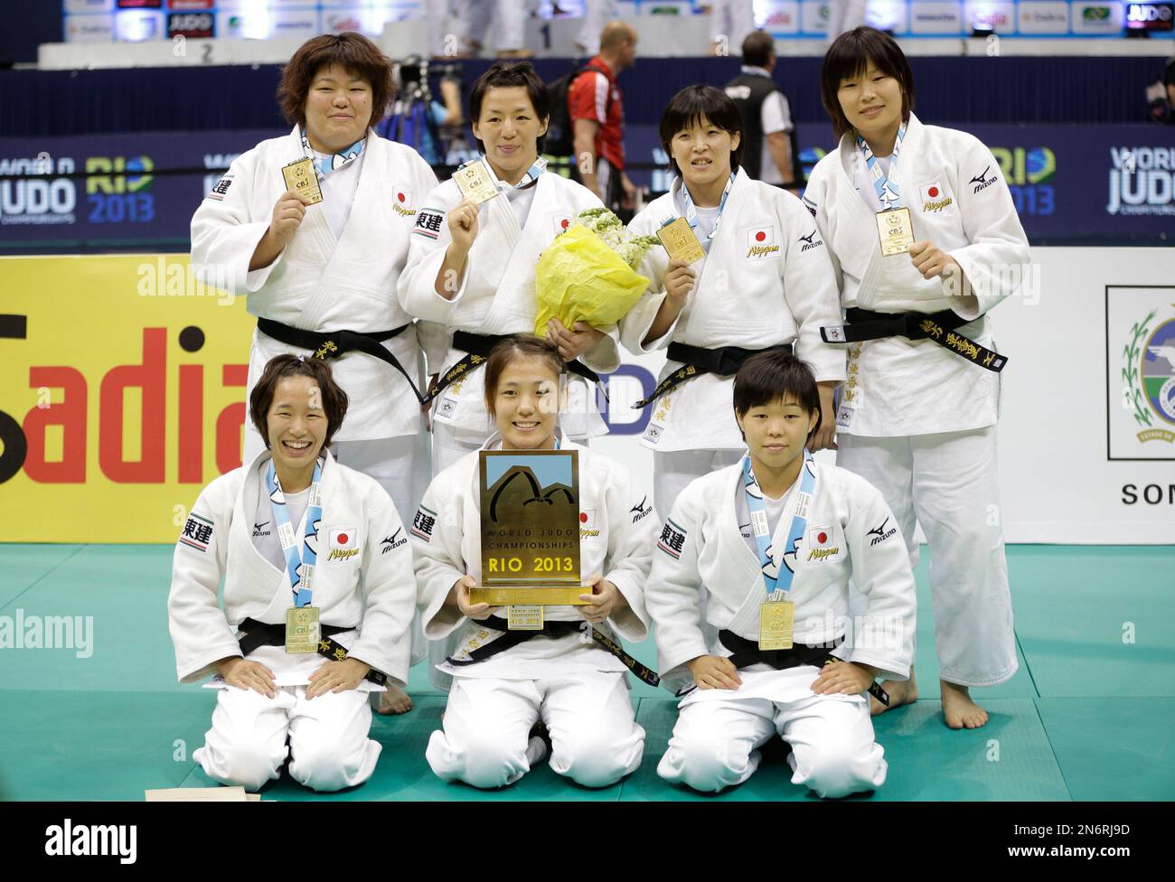 Japan women's national Judo Team poses for a photo holding their gold ...