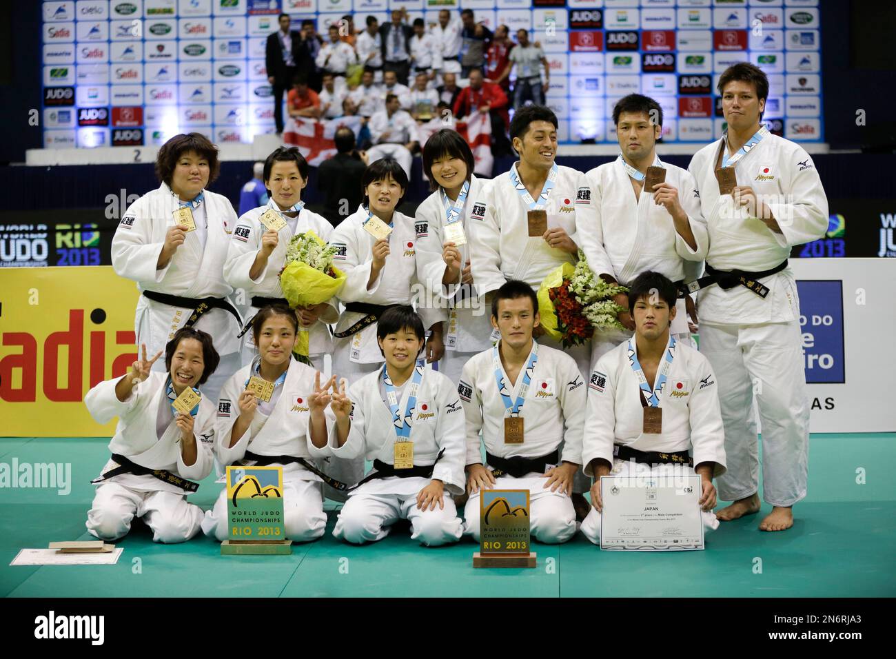 Japan men's and women's national Judo Team pose for a photo holding ...
