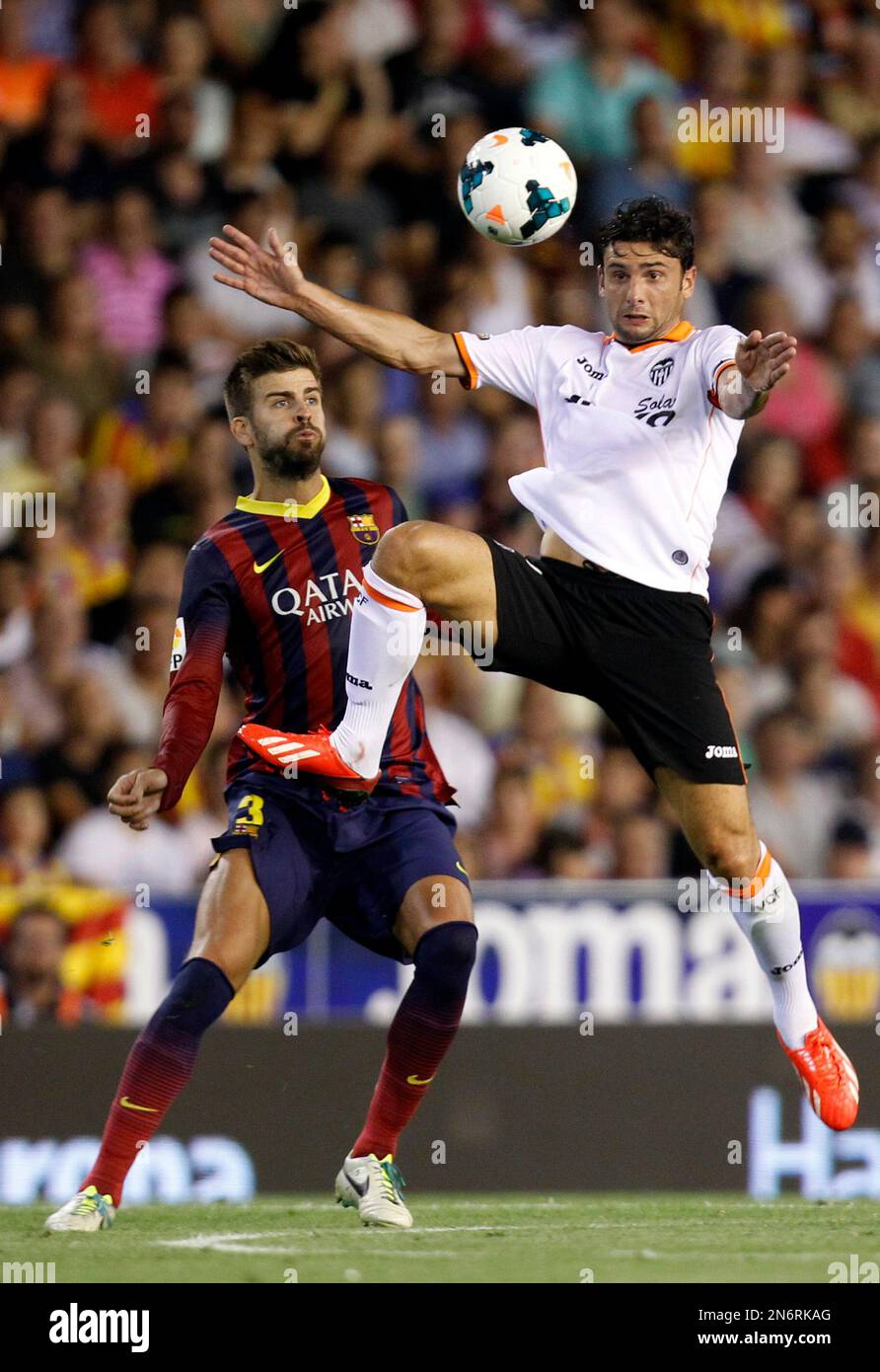 Valencia's Helder Postiga from Portugal heads the ball next to ...