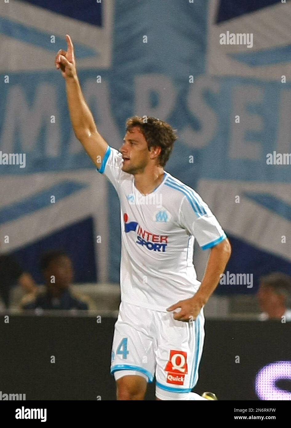 Marseille's Brazilian defender Lucas Mendes, reacts after scoring ...