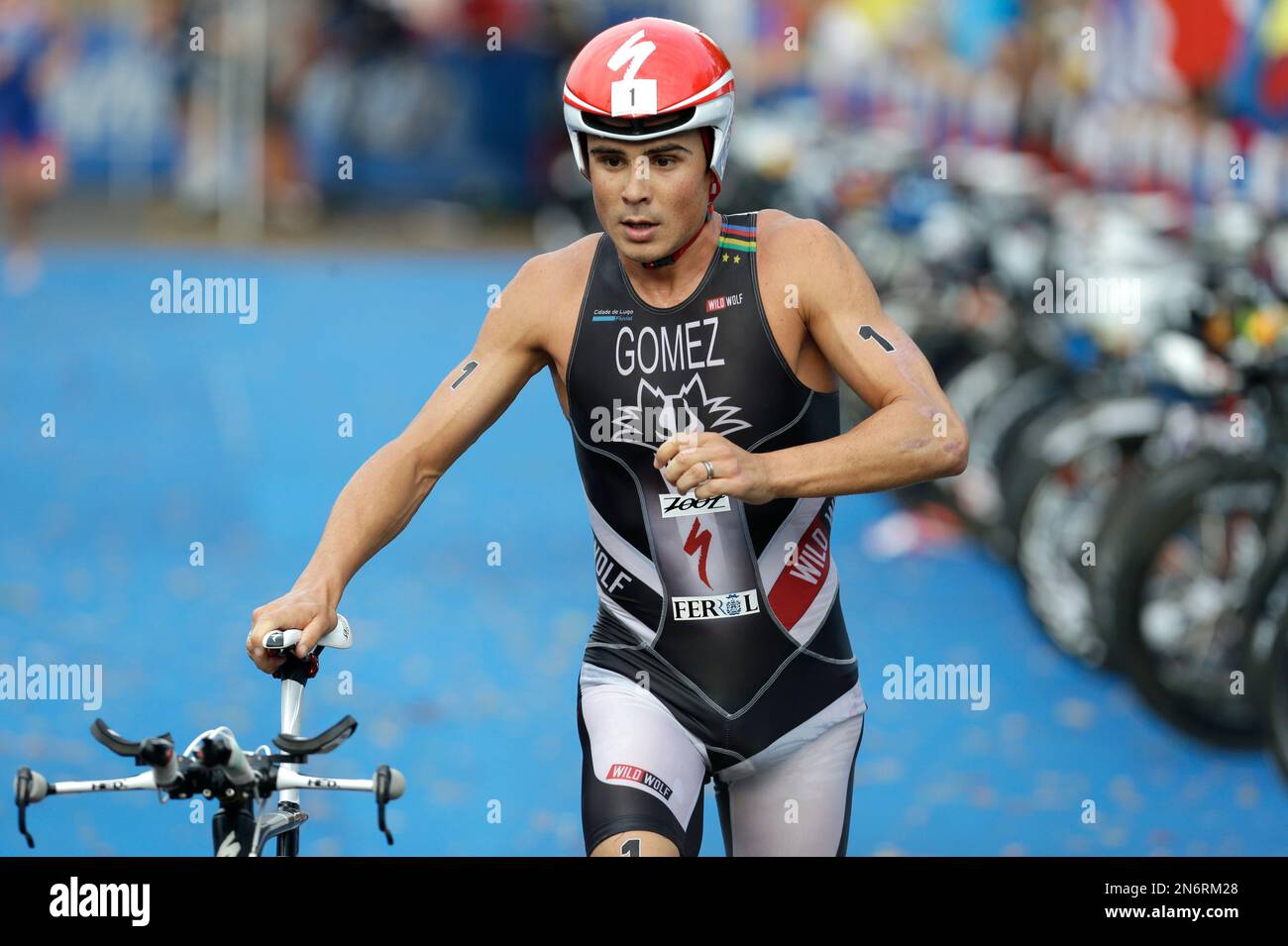 Javier Gomez makes his way through a transition zone in the elite men's ...