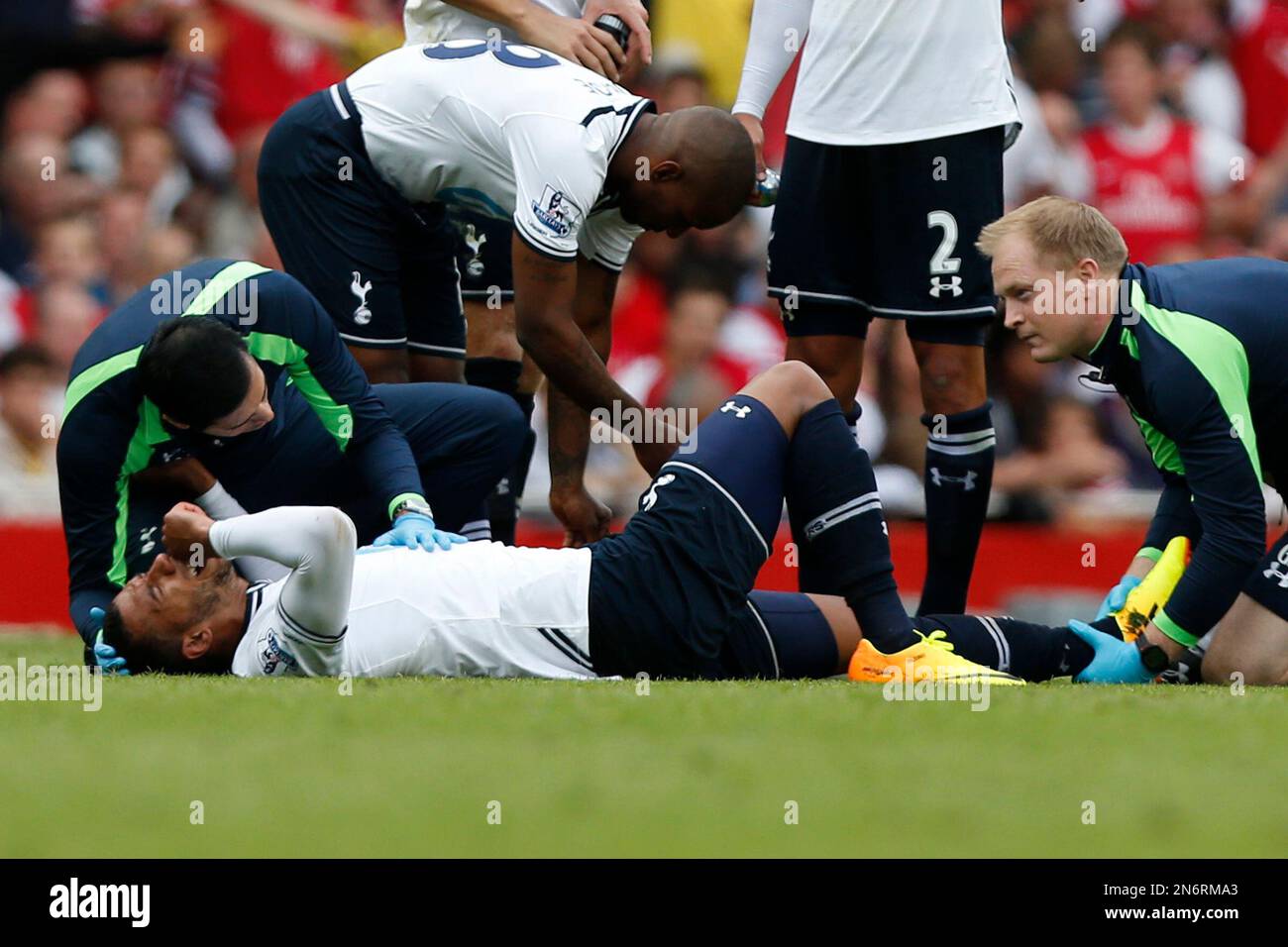 Tottenham Hotspur's Etienne Capoue is treated during their English ...