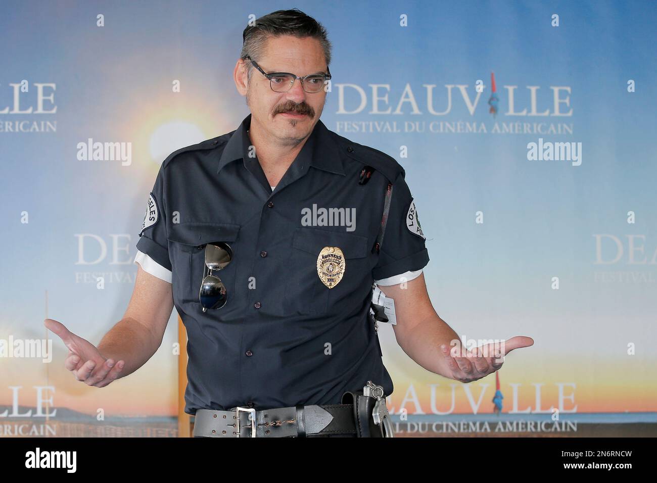 Actor Mark Burnham poses during a photocall for the film "Wrong Cops ...
