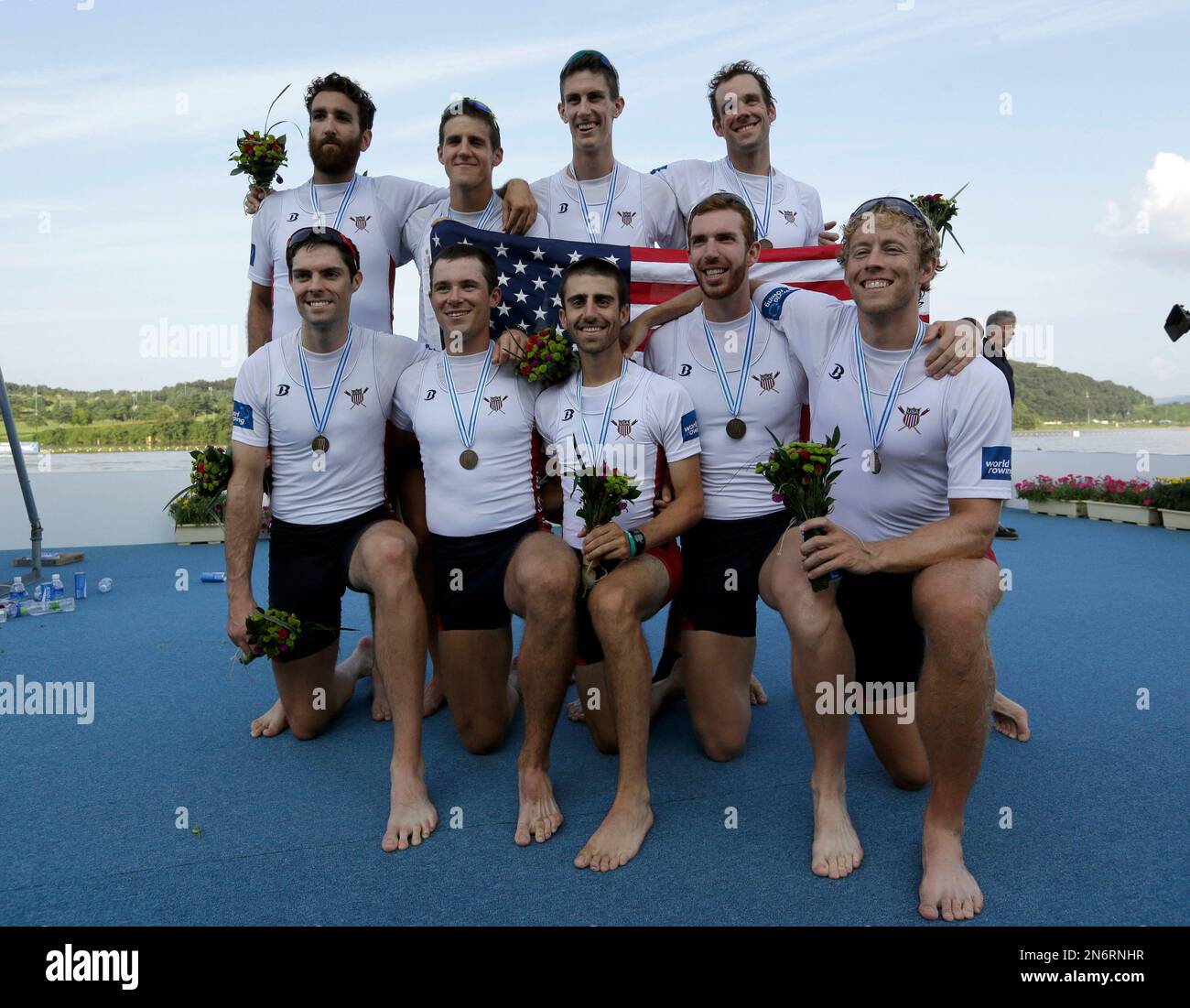 The U.S. team members pose for photographers during a medal ceremony ...