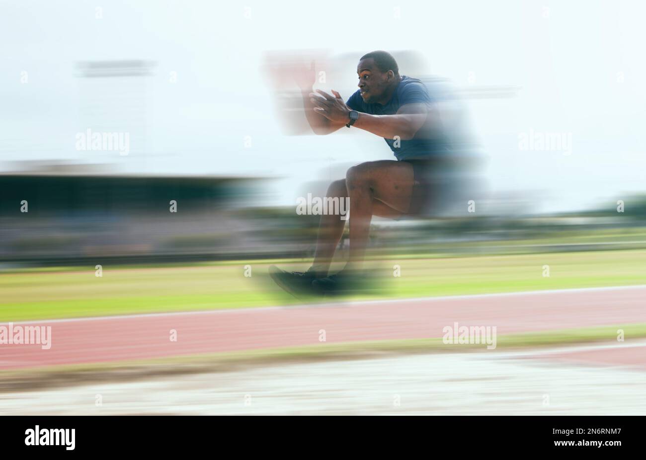 Black man, fitness and high jump exercise at stadium for training ...