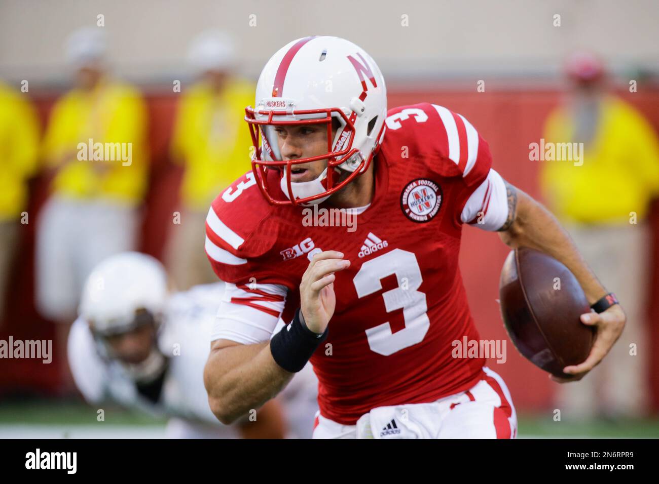 Nebraska quarterback Taylor Martinez carries the ball in the first half ...