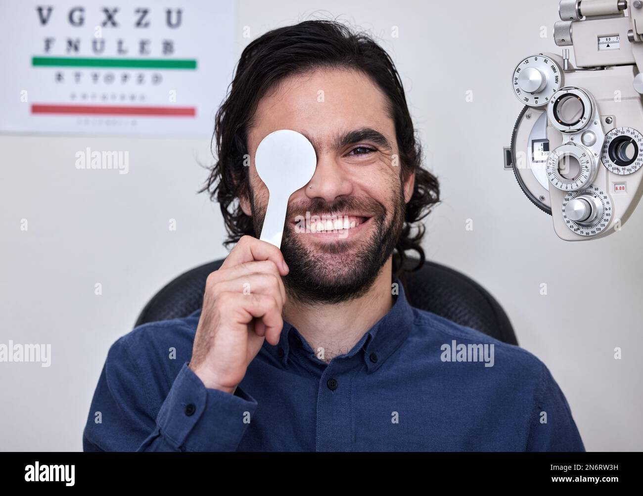 Man, portrait or covering eyes in test for medical glasses ...