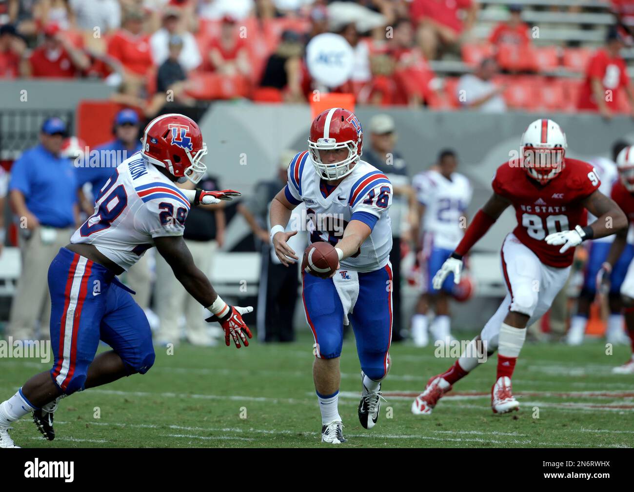 Louisiana Tech quarterback Scotty Young (16) hands off to Kenneth Dixon ...