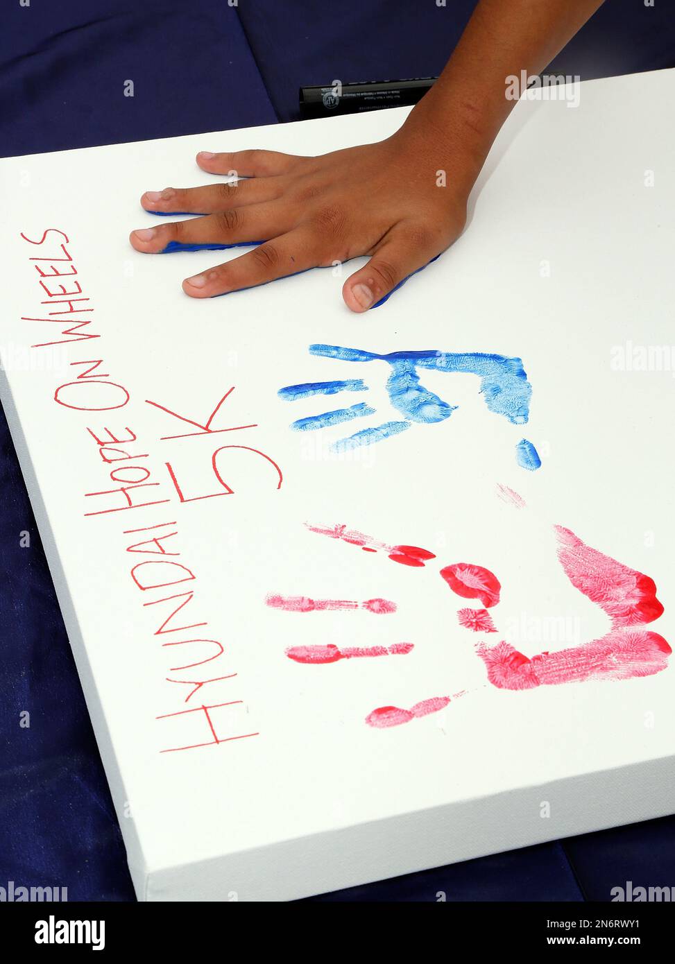 A child's hand at the handprint ceremony during the Hyundai Hope on ...
