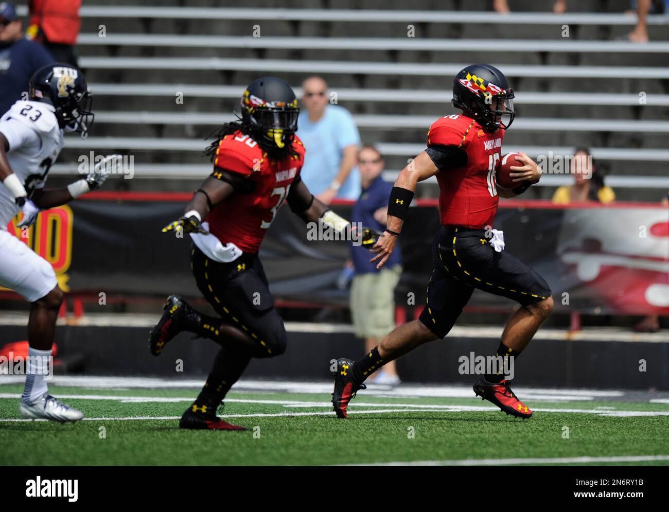 Maryland quarterback C.J. Brown, right, heads for the end zone en route ...