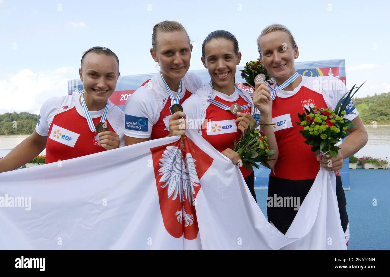 Poland's team members pose for the media during a medal ceremony after ...