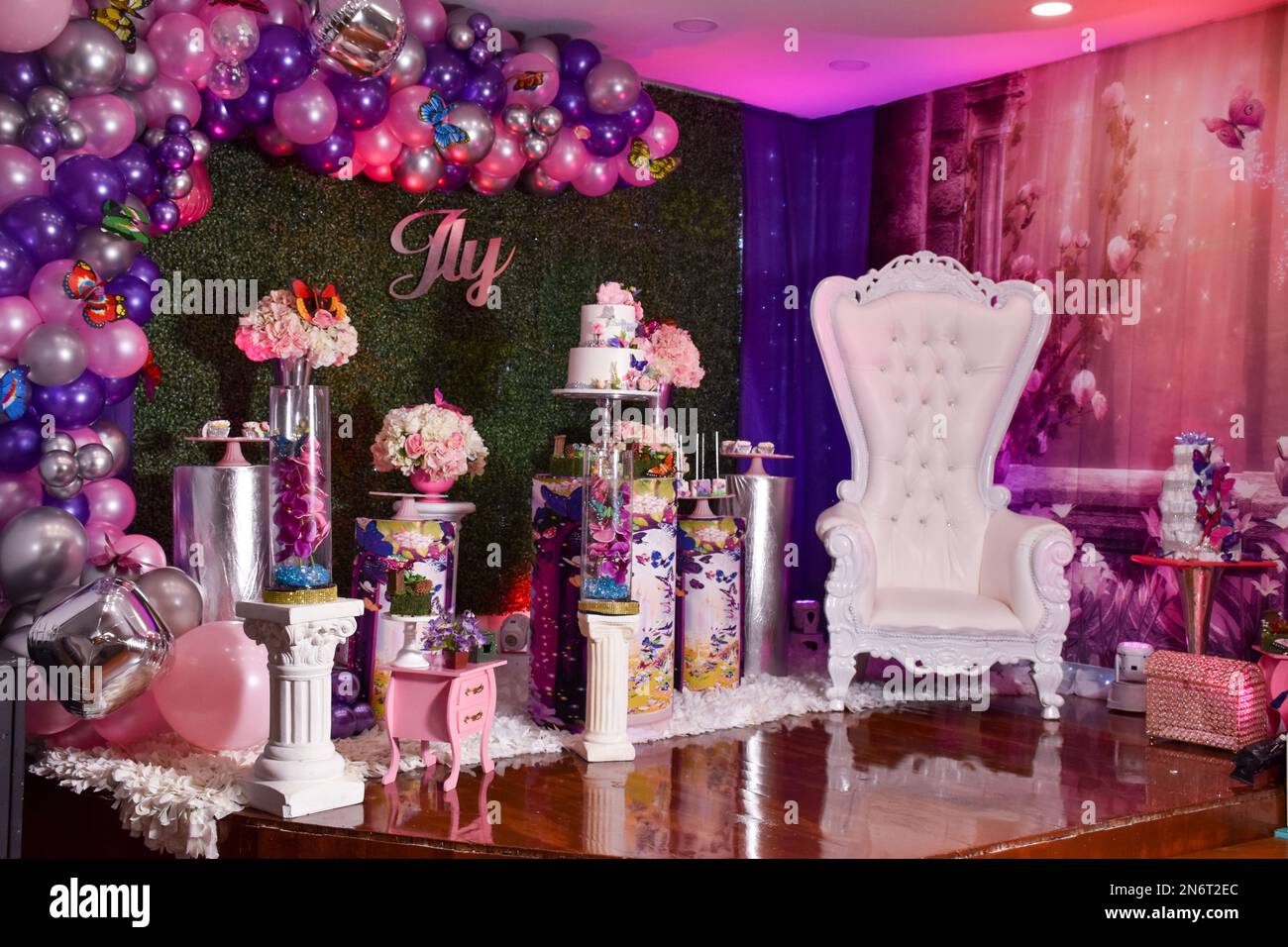 wedding reception. Birthday Cake on a background balloons party decor ...