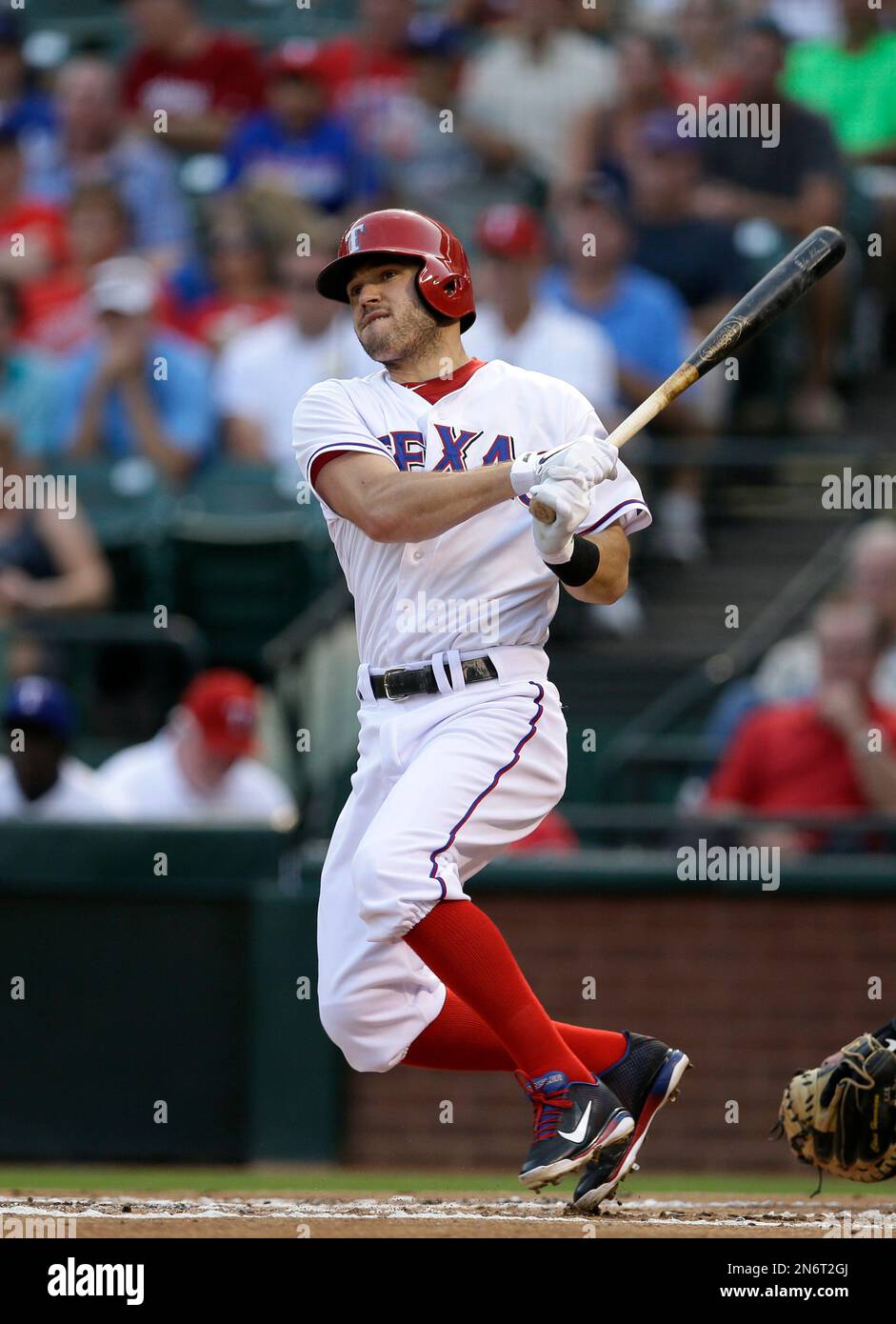 Texas Rangers' Ian Kinsler (5) follows through on a swing against the ...