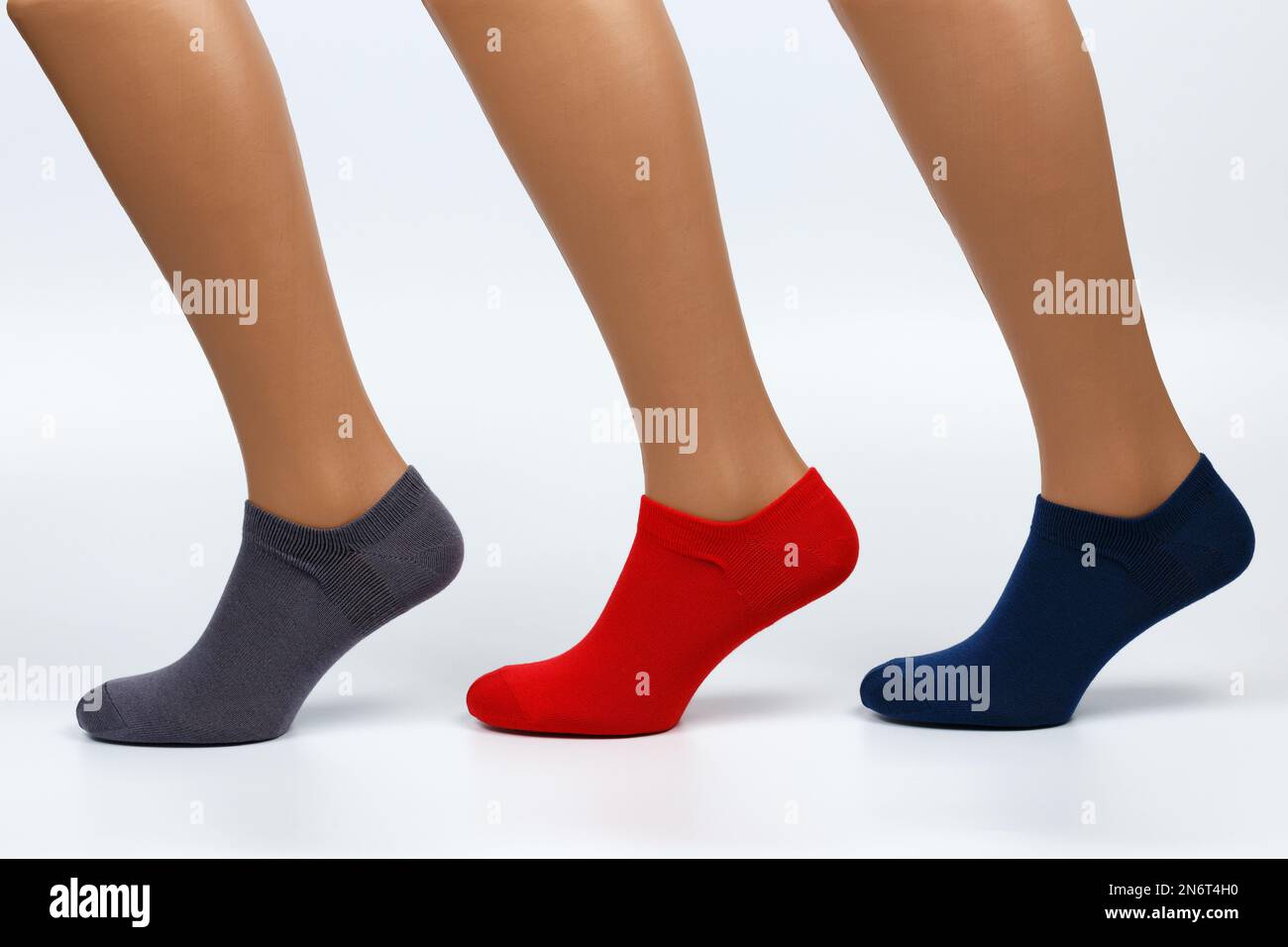 Socks on the leg. Socks on a white background Stock Photo - Alamy
