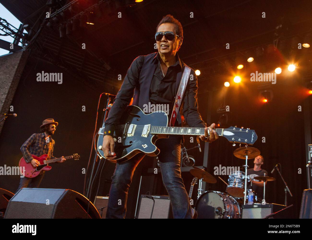 Band members with Alejandro Escovedo (r) perform at the Harley-Davidson ...