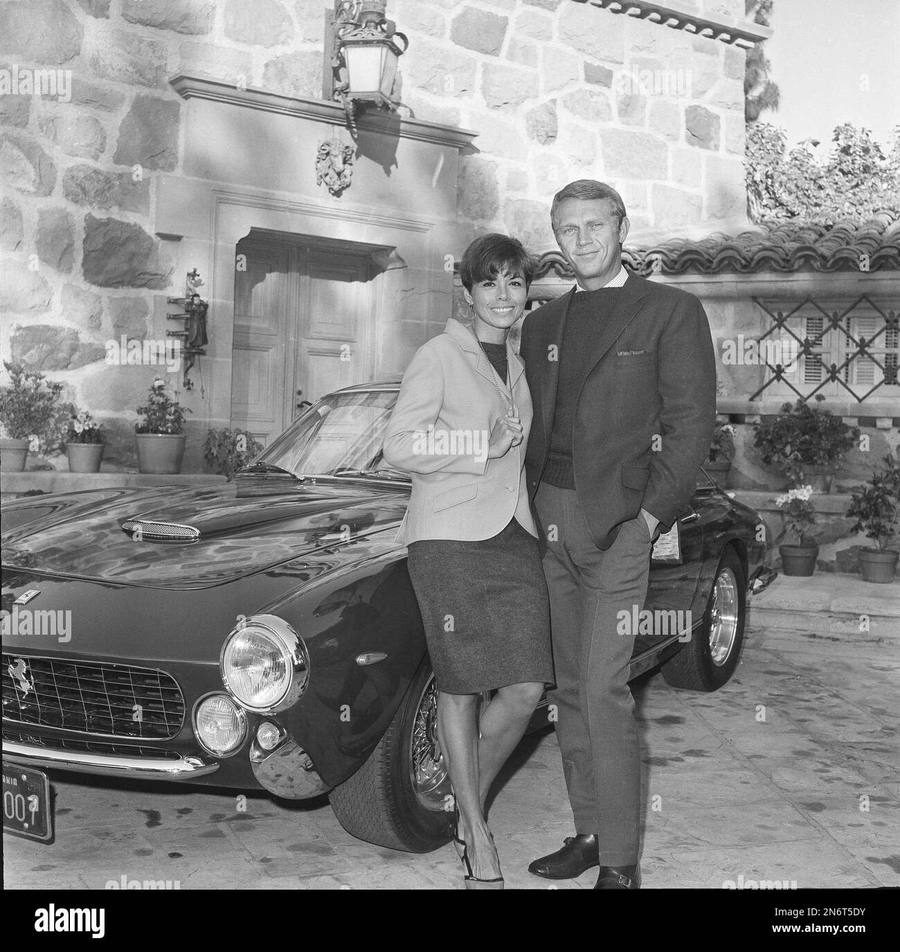 Film and TV star Steve McQueen and his wife Neile stand by his sports ...